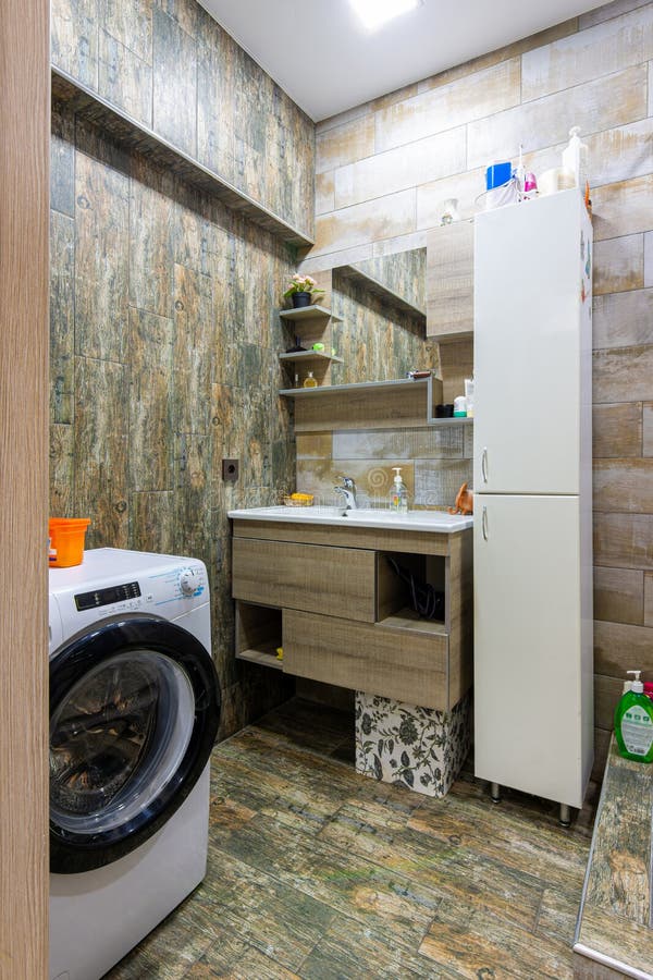 Interior of a Cozy Compact Modern Bathroom with a Washing Machine Stock ...