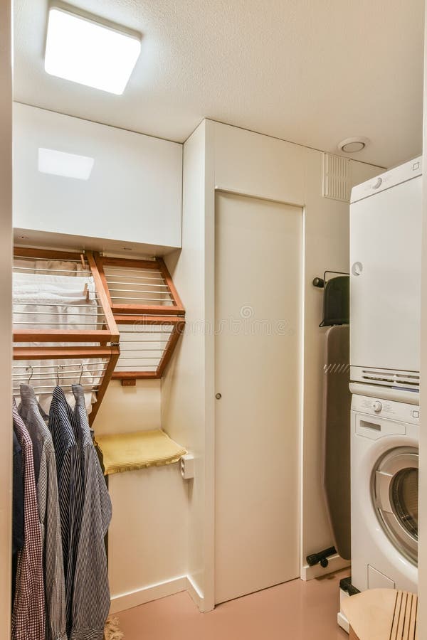 Interior of Cozy Laundry Room with White Walls Stock Photo - Image of ...