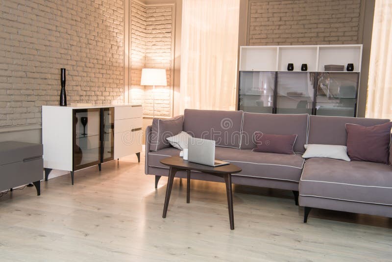 Interior of Cozy Living Room with Couch and Laptop Stock Photo - Image ...