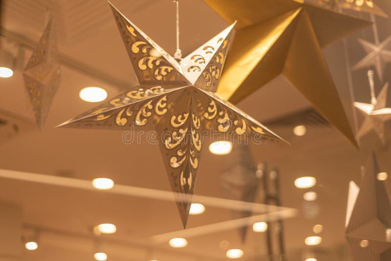 Interior Decor: Golden Star Volume Hung on a String Stock Image - Image ...