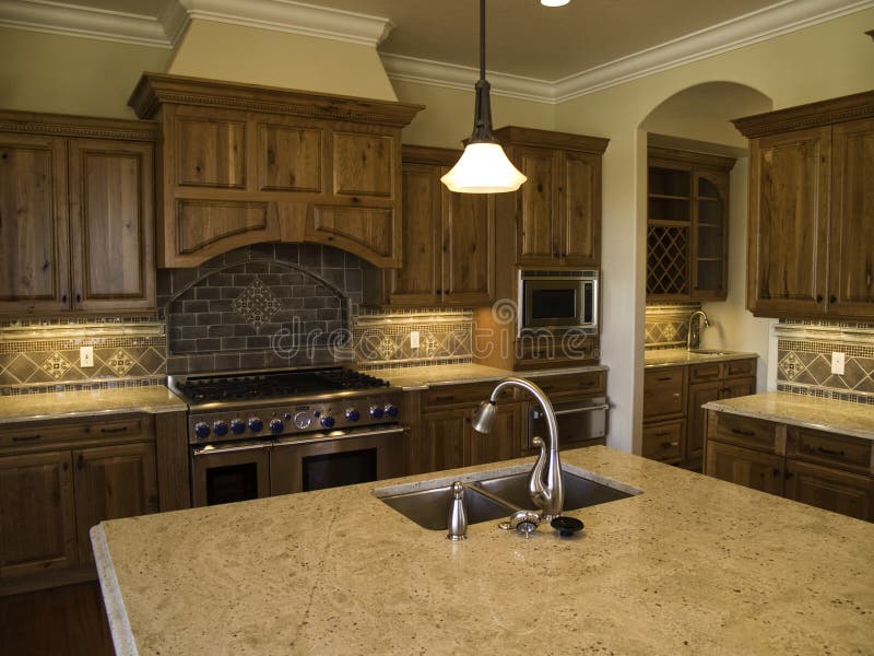 Kitchen Interior with Stone Accents in Affluent Ho Stock Photo - Image ...