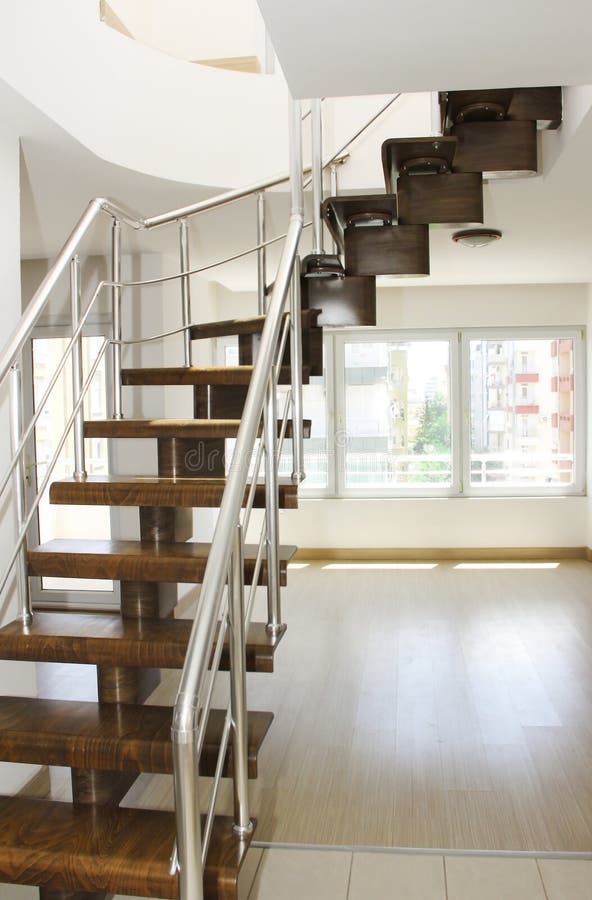 Interior Design of a Duplex Apartment with White Walls and a Brown ...