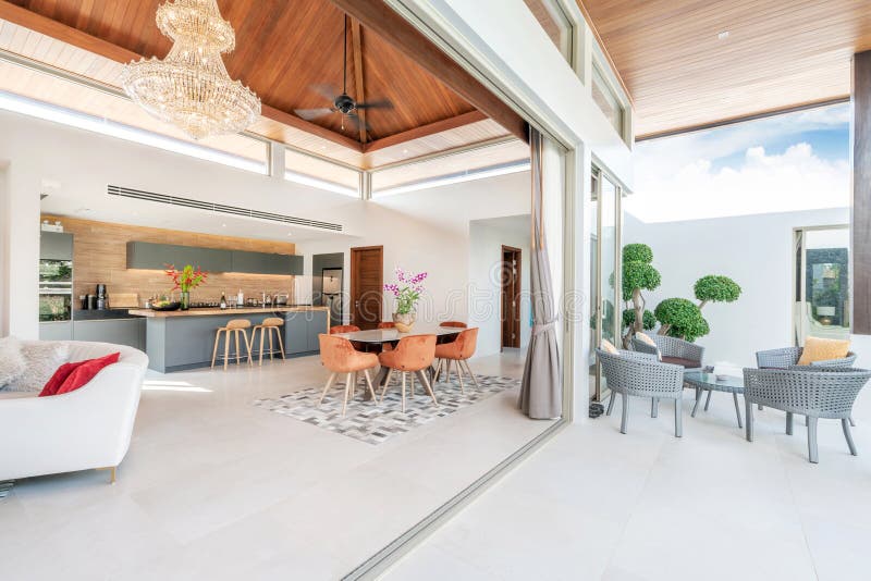 Interior Design in Living Room and Open Kitchen Area with Dining Table ...