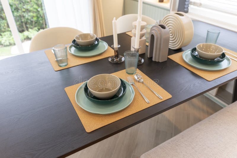 Interior Design of Modern Dining Room and Green Plate Setting on Table ...