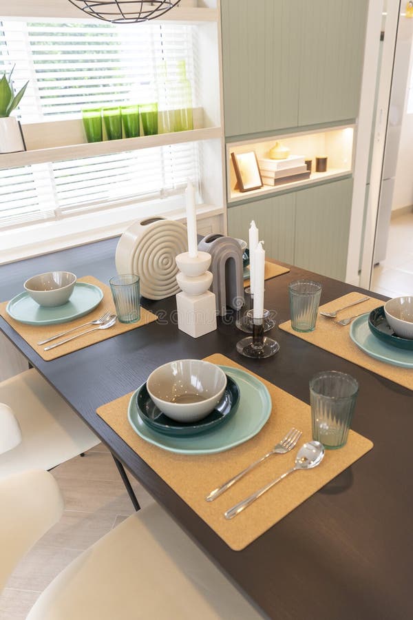 Interior Design of Modern Dining Room and Green Plate Setting on Table ...