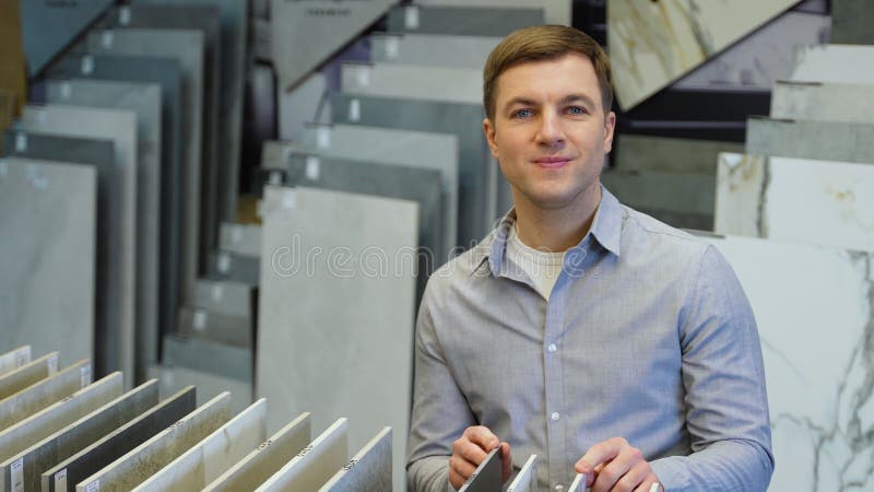 Interior Designer Choosing Flooring Tile Color Texture Samples at ...