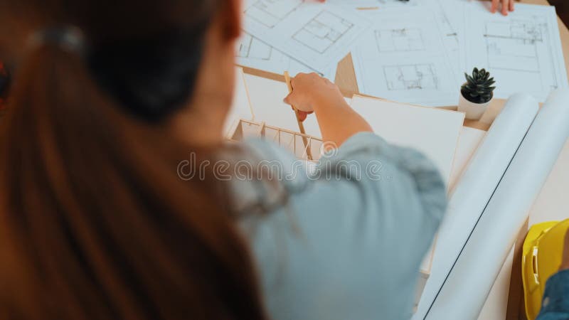 Skilled Interior Designer Team Focusing on Their Performance ...