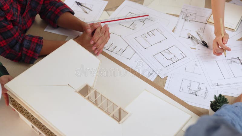 Skilled Interior Designer Team Focusing on Their Performance ...