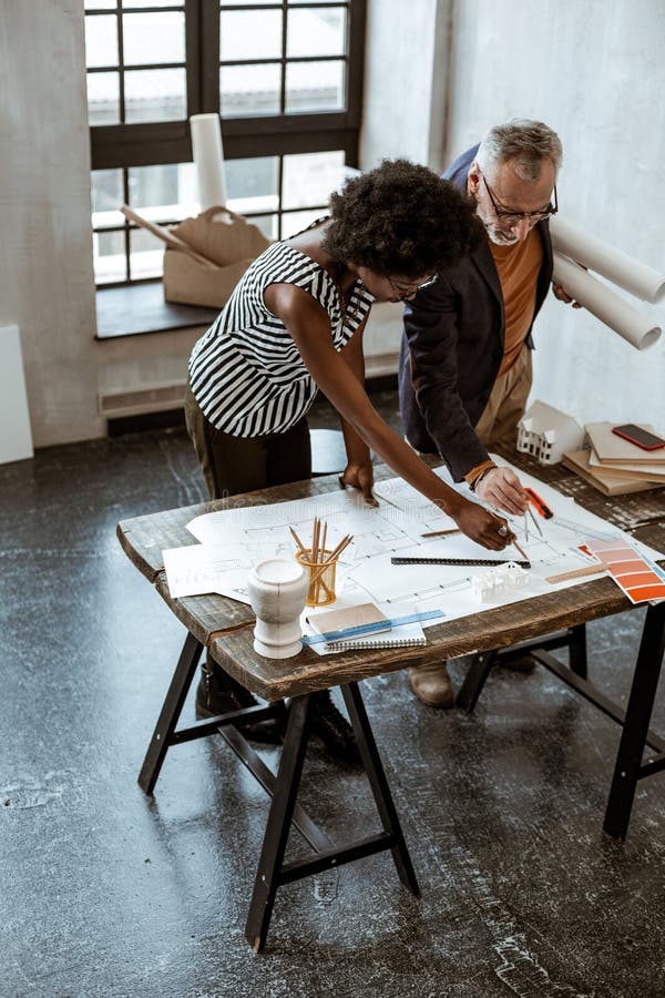 Interior Designer Explaining Some Difficult Moments To His Trainee ...