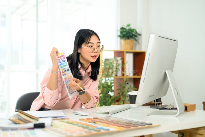 Interior Designer Presenting Color Choices during Video Call with Her ...