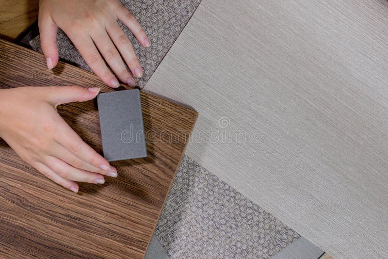 An Interior Designer S Hand Selects a Palette of Sample Materials that ...