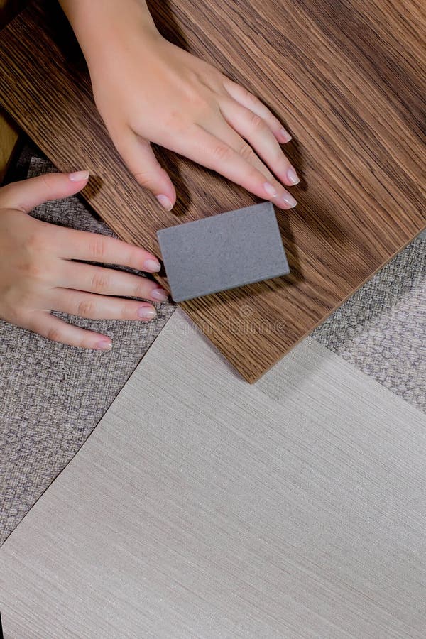 An Interior Designer S Hand Selects a Palette of Sample Materials that ...