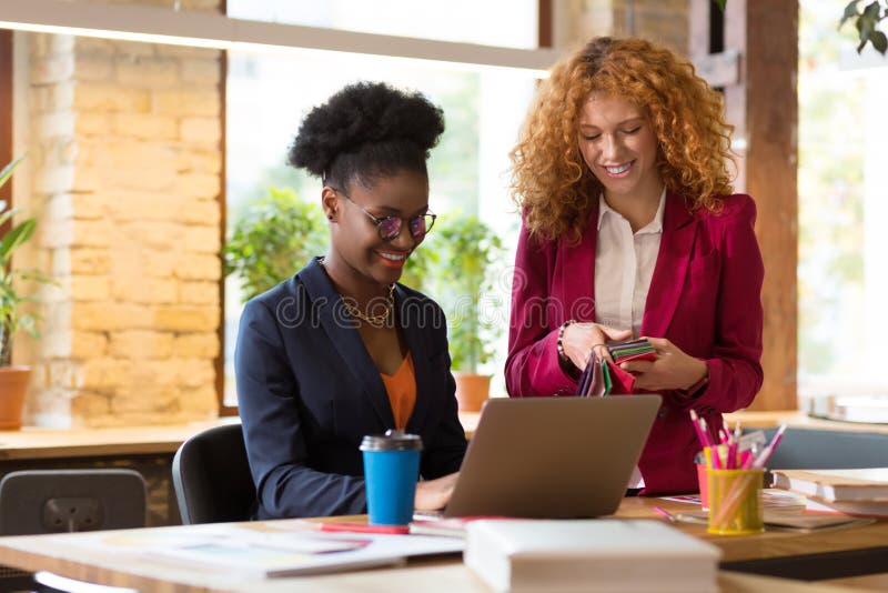 Interior Designer Smiling while Working Together on One Project Stock ...
