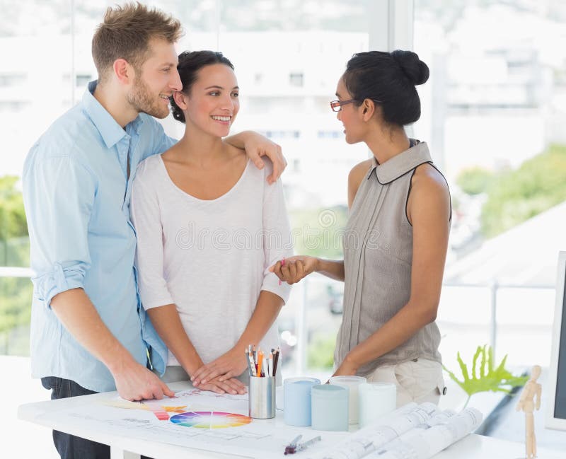 Interior Designer Shaking Hands with Smiling Client Stock Photo - Image ...