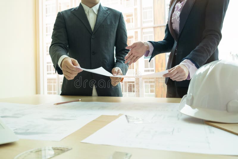 Interior Designer Team Planning with Construction House on Blue Stock ...