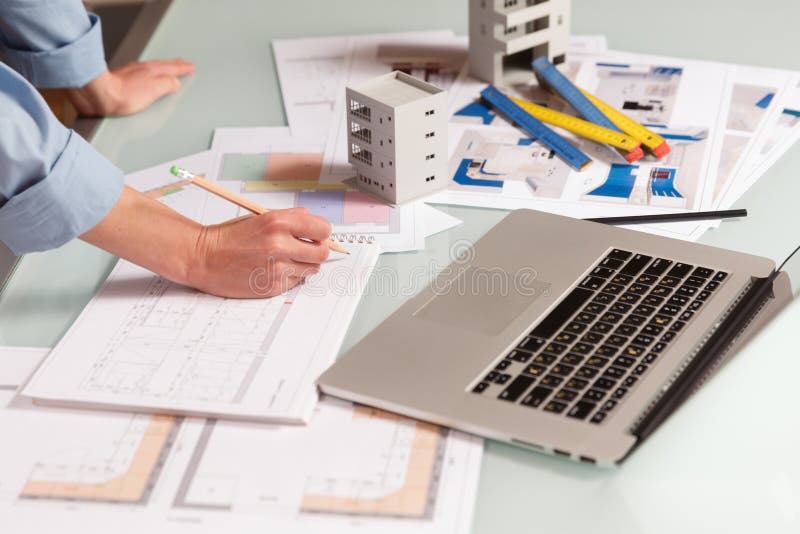 Interior Designer Working with an Apartment Plans in a Studio, with ...