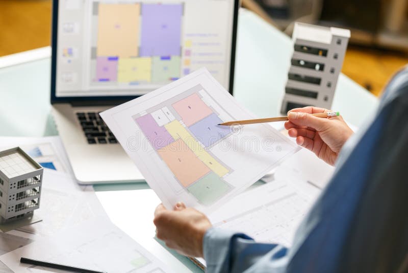 Interior Designer Working with an Apartment Plans in a Studio, with ...