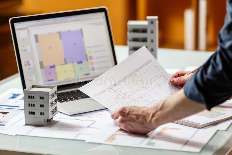 Interior Designer Working with an Apartment Plans in a Studio, with ...