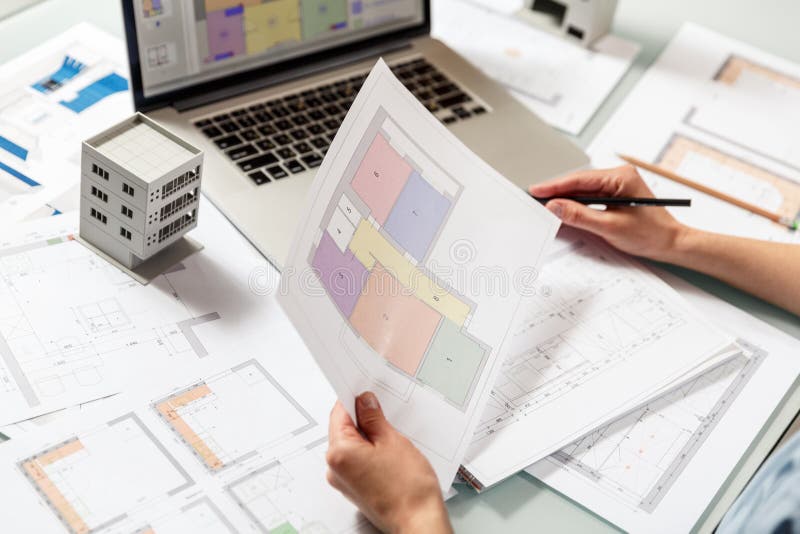 Interior Designer Working with an Apartment Plans in a Studio, with ...