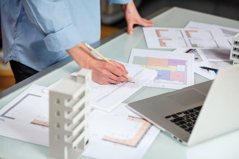 Interior Designer Working with an Apartment Plans in a Studio, with ...