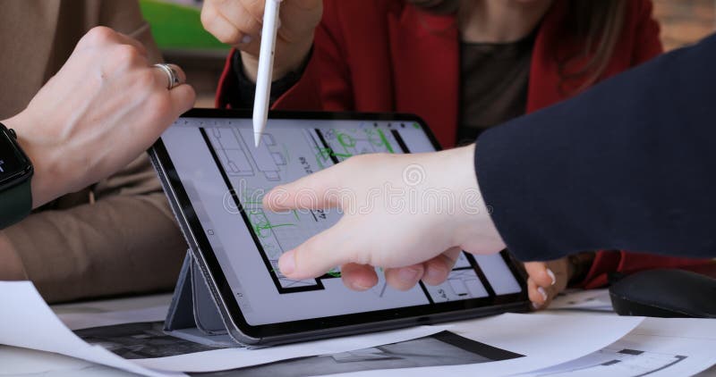 Interior Designers Using Tablet for Design, Focusing on Floor Plan ...