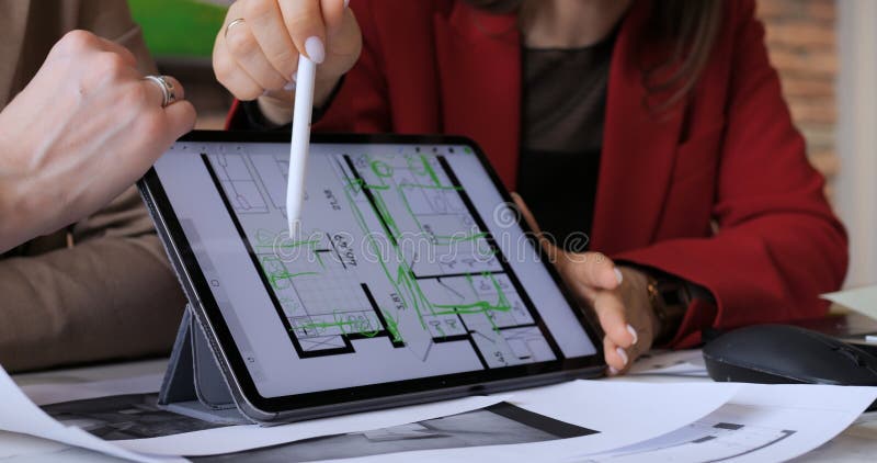 Interior Designers Using Tablet for Design, Focusing on Floor Plan ...