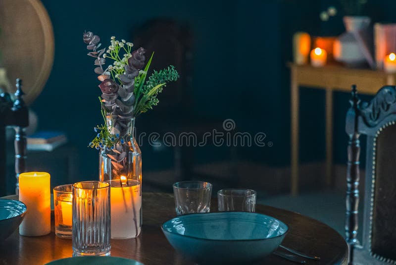 Interior of the Dining Room with Dark Blue Walls and Candles on the ...