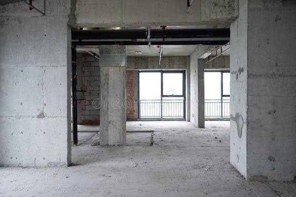 Empty Concrete Building Under Construction Showing Windows and Pillars ...