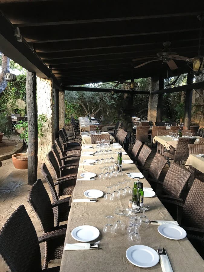 Interior of Empty Cozy Restaurant with Served Long Tables in ...