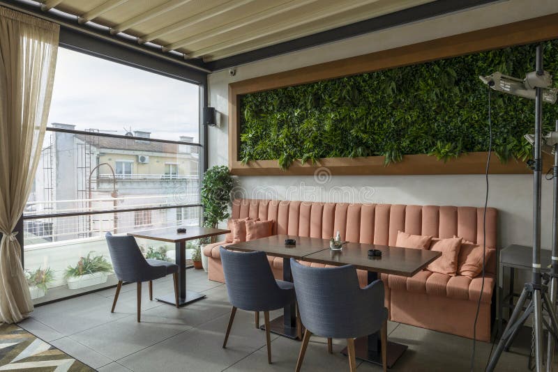 Interior of an Empty Restaurant with a View and a Grass Wall Decoration ...