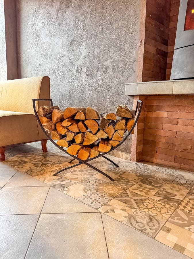 Interior with Firewood in Metal Rack, Textured Wall, Patterned Tiles ...