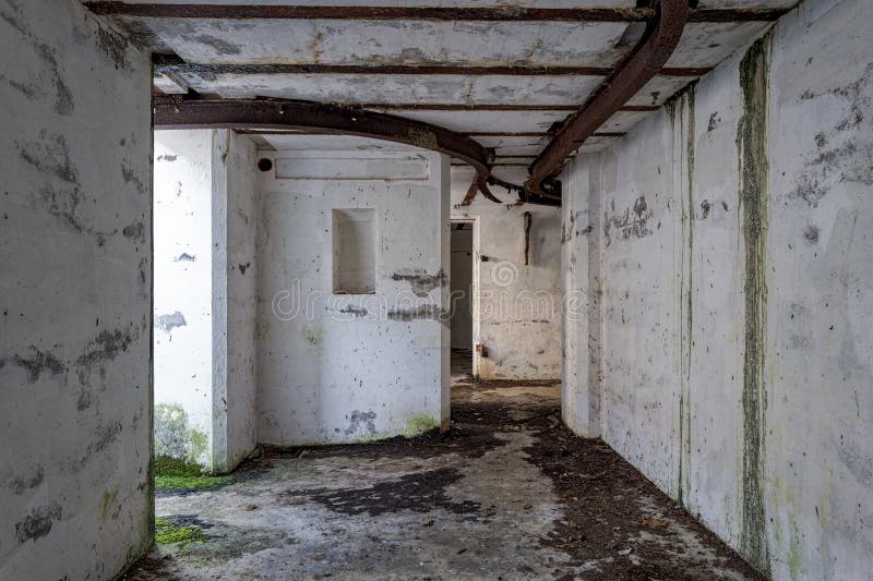 The Interior Hallway of an Abandoned Military Bunker with Ceiling Rails ...