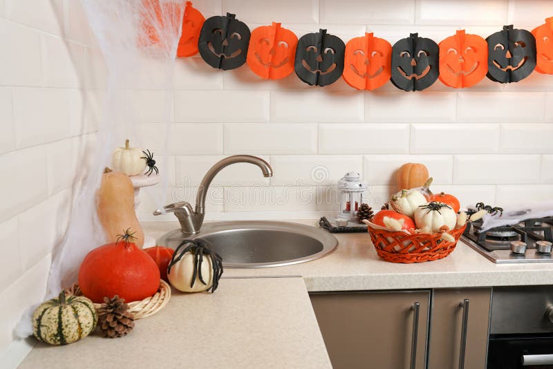 Interior Halloween with Pumpkins, Spider Web and Garland in the Kitchen ...
