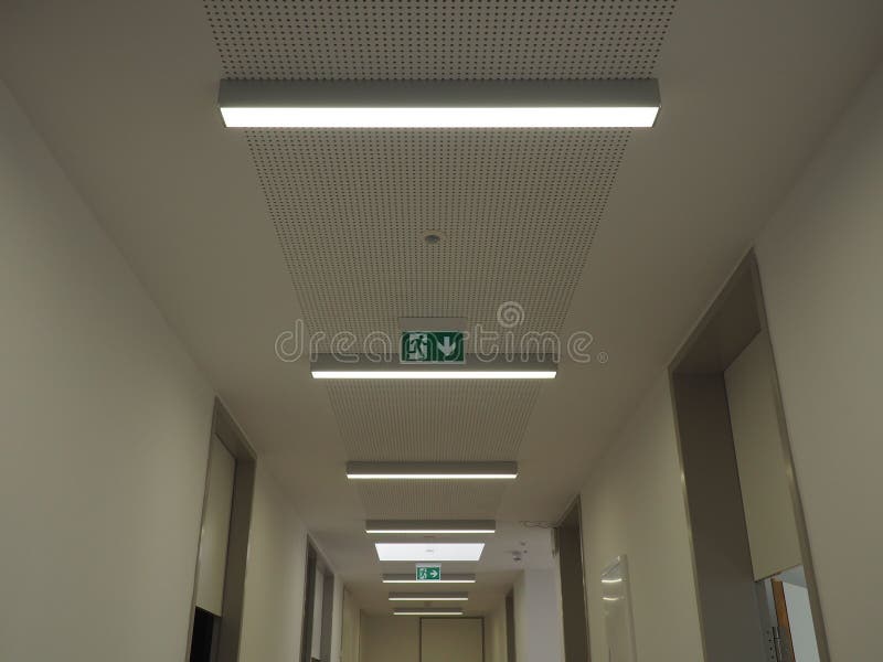 Interior Hallway with a Sign Pointing To the Exit. Stock Photo - Image ...