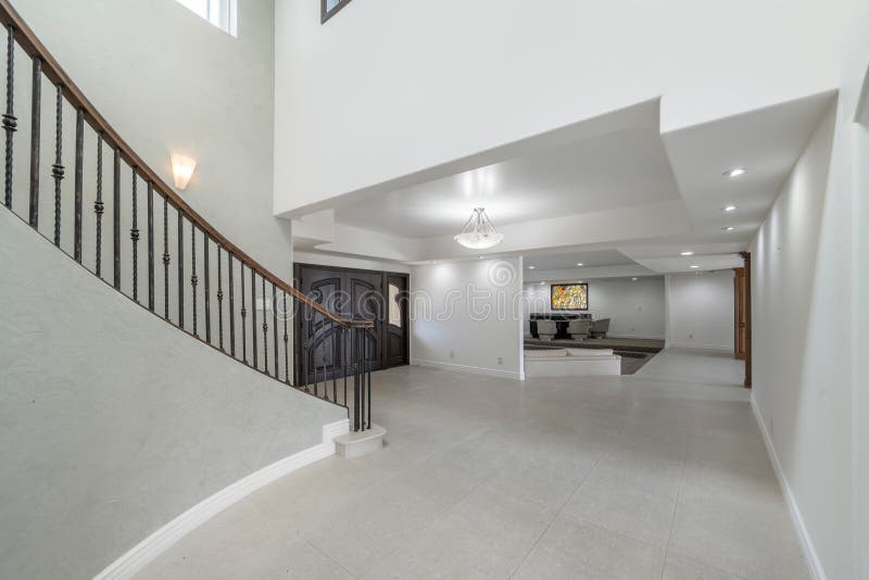 Interior of Home Hallway with Elegant Chandelier and Spacious Layout in ... Interior of Home Hallway with Elegant Chandelier and Spacious Layout in ...