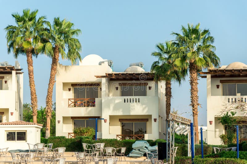 The Interior of the Hotel, Two-story Houses among the Palm Trees Stock ...