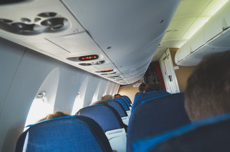 Plane with passengers stock photo. Image of people, cabin - 174049558