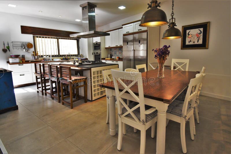 Interior of a Kitchen Including the Tables, Chairs and the Stove ...