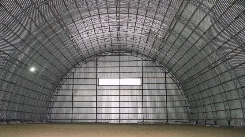 Empty Arched Warehouse with Metal Walls and Ground Stock Image - Image ...