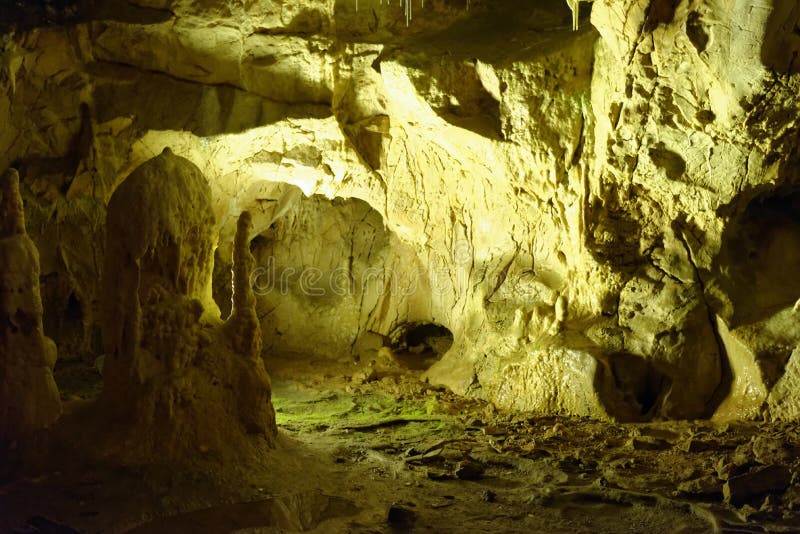 Interior of a lighted cave stock image. Image of underground - 61318487