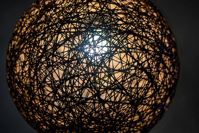 Interior Lighting is on. Round Decorative with Wicker Texture Over Lamp ...
