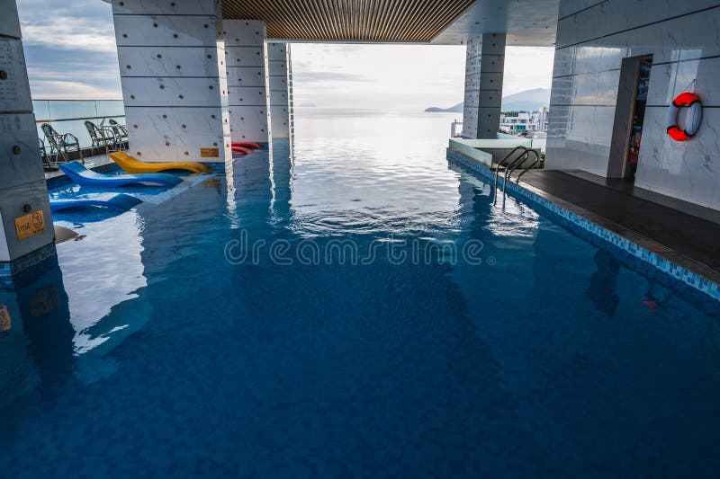 Interior of Luxury Skyscraper Hotel with a Rooftop Pool Overlooking the ...