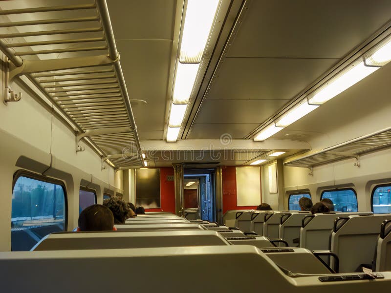 Interior of a Modern Commuter Train in Motion with Passengers Stock ...