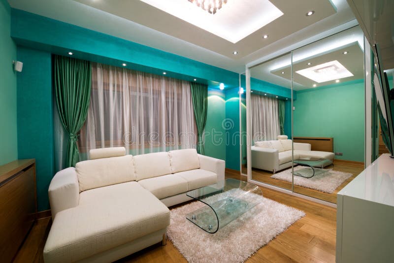Interior of a Modern Green Living Room with Luxury Ceiling Light Stock ...