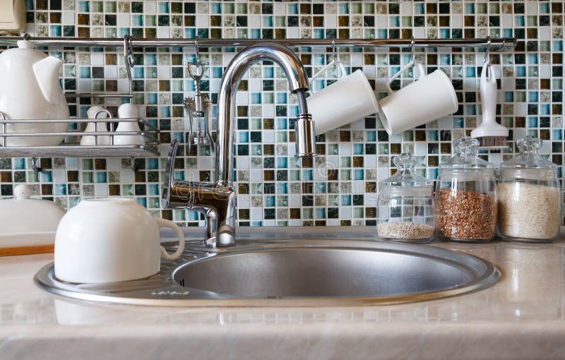 Interior of Modern Kitchen. Kitchen Faucet, Sink and Various Ceramic ...