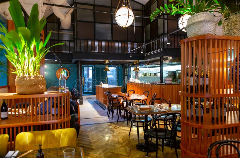 Interior of Modern Loft Style Restaurant with Fresh Flowers Stock Image ...