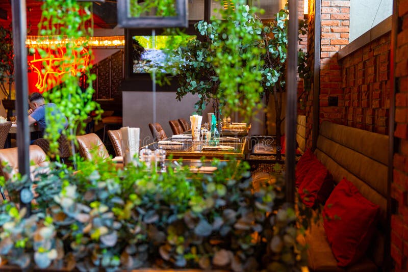 Interior of Modern Loft Style Restaurant with Live Plants Stock Photo ...