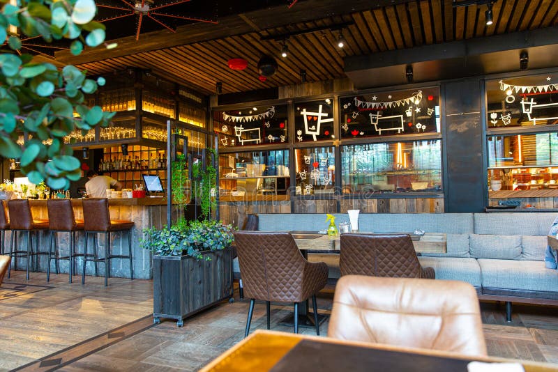 Interior of Modern Loft Style Restaurant with Live Plants Stock Photo ...
