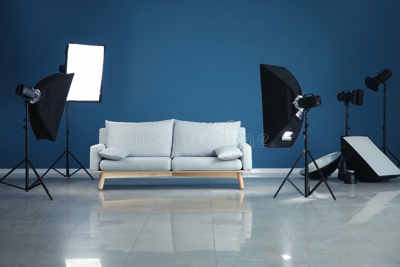 Interior of Modern Photo Studio with Professional Equipment and Sofa ...