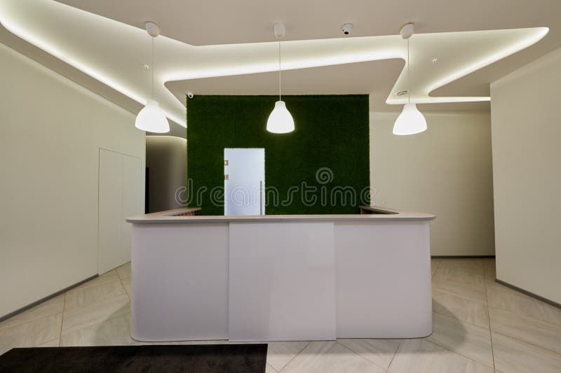 Modern Reception Desk with Concrete Wall and Spotlights. Reception Area ...